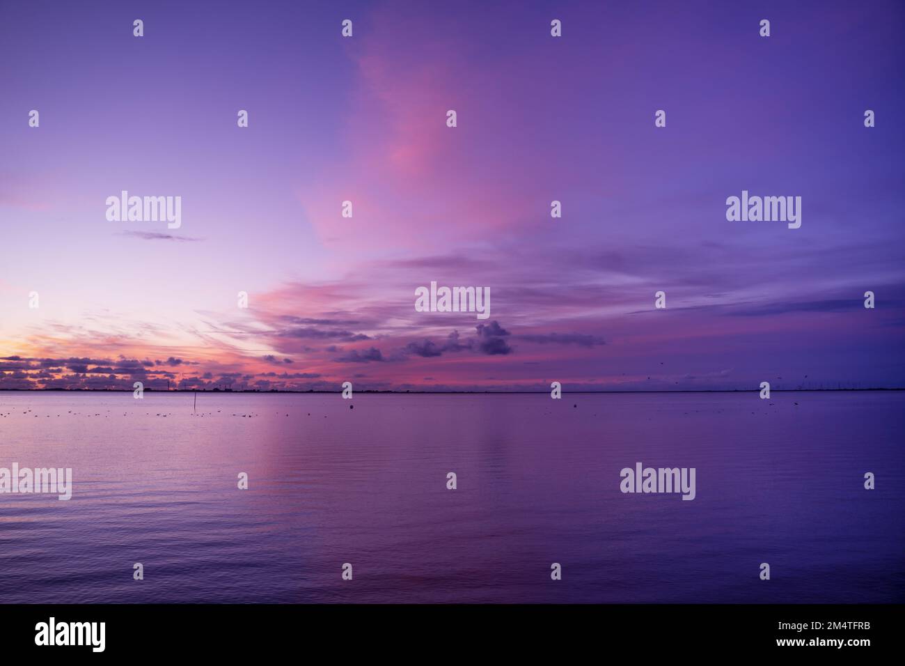 A scenic view of a beautiful sunset over the ocean in the sky in the ...
