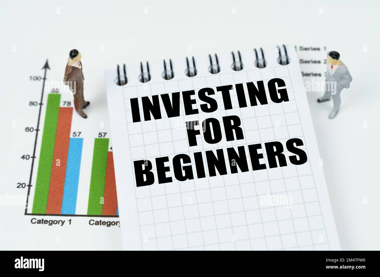 Business and finance concept. On the chart there are miniature figures ...