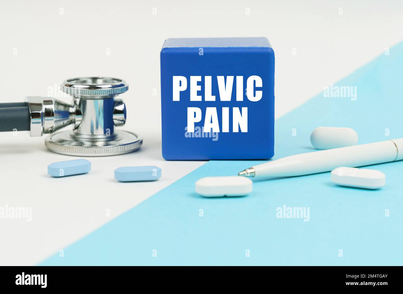 Medical concept. On a white and blue surface are pills, a stethoscope ...
