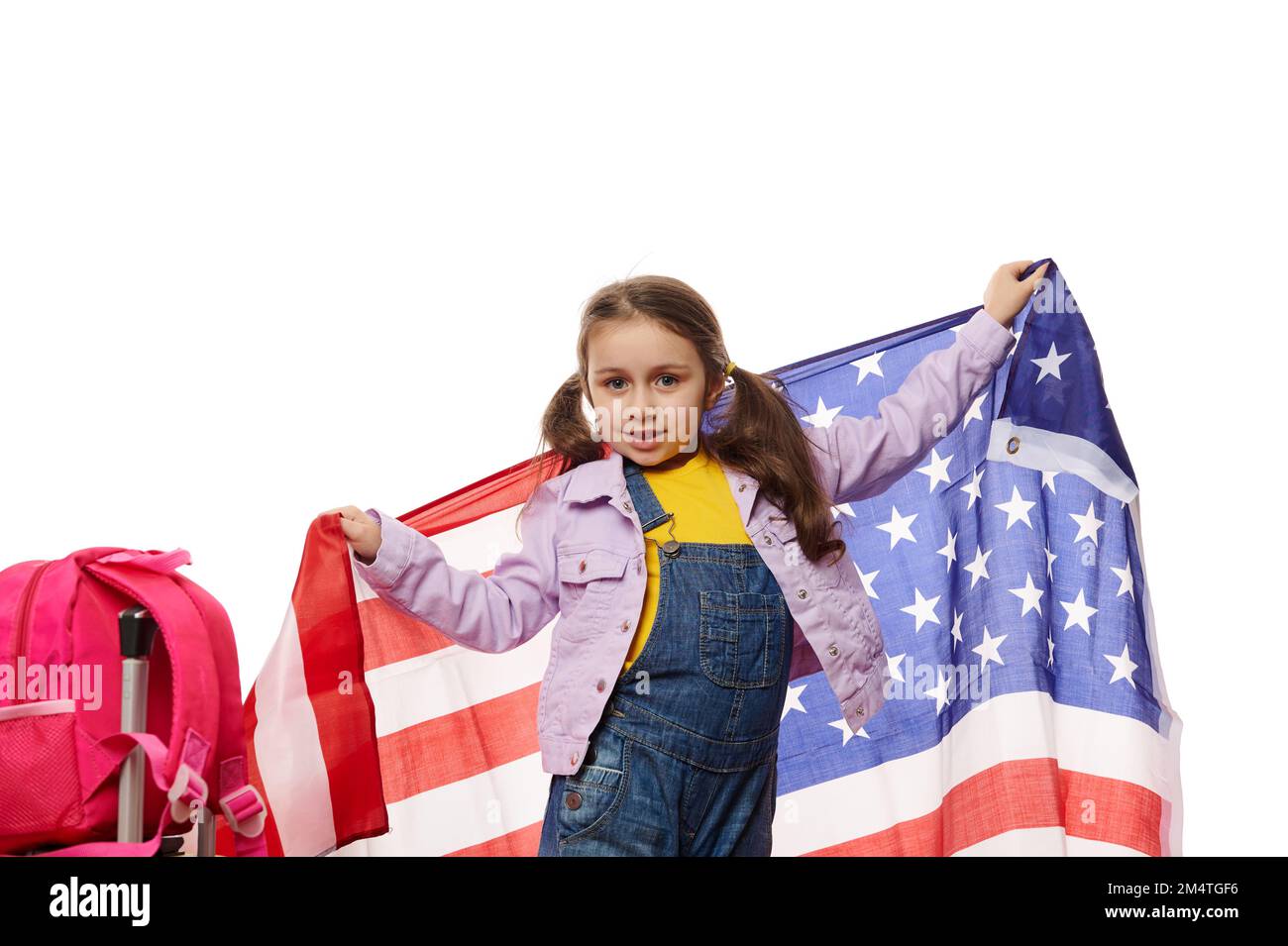 Happy little girl, American citizen carrying USA flag on white ...