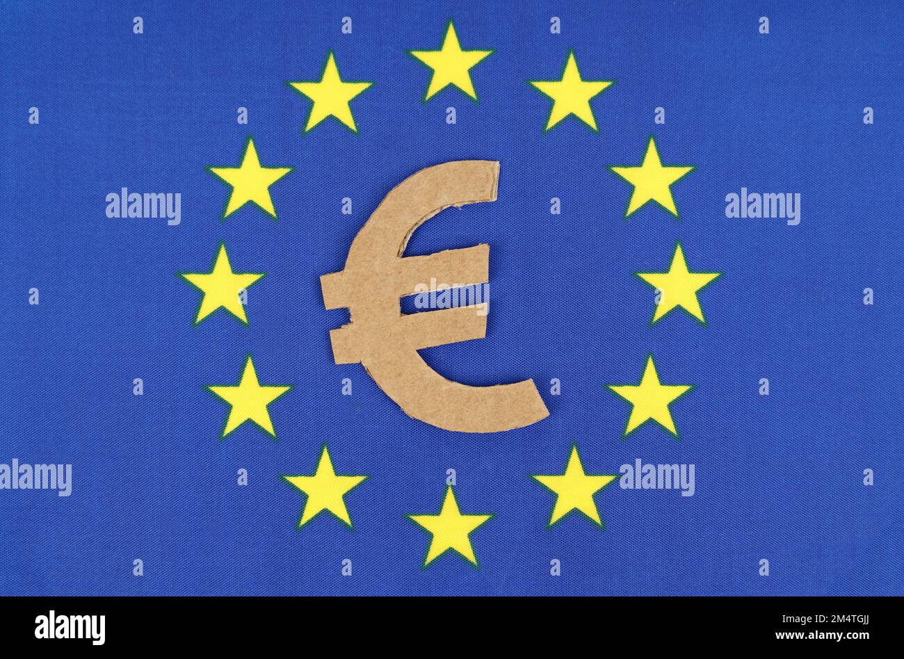 Economy and finance concept. The euro symbol on the flag of the ...