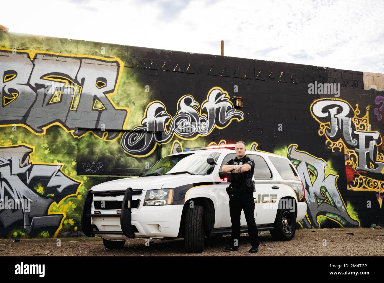 Horizontal image of white male caucasian police officer with arms ...