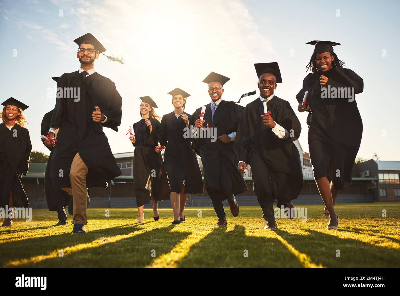 Were finally free. a group of university students running after being ...
