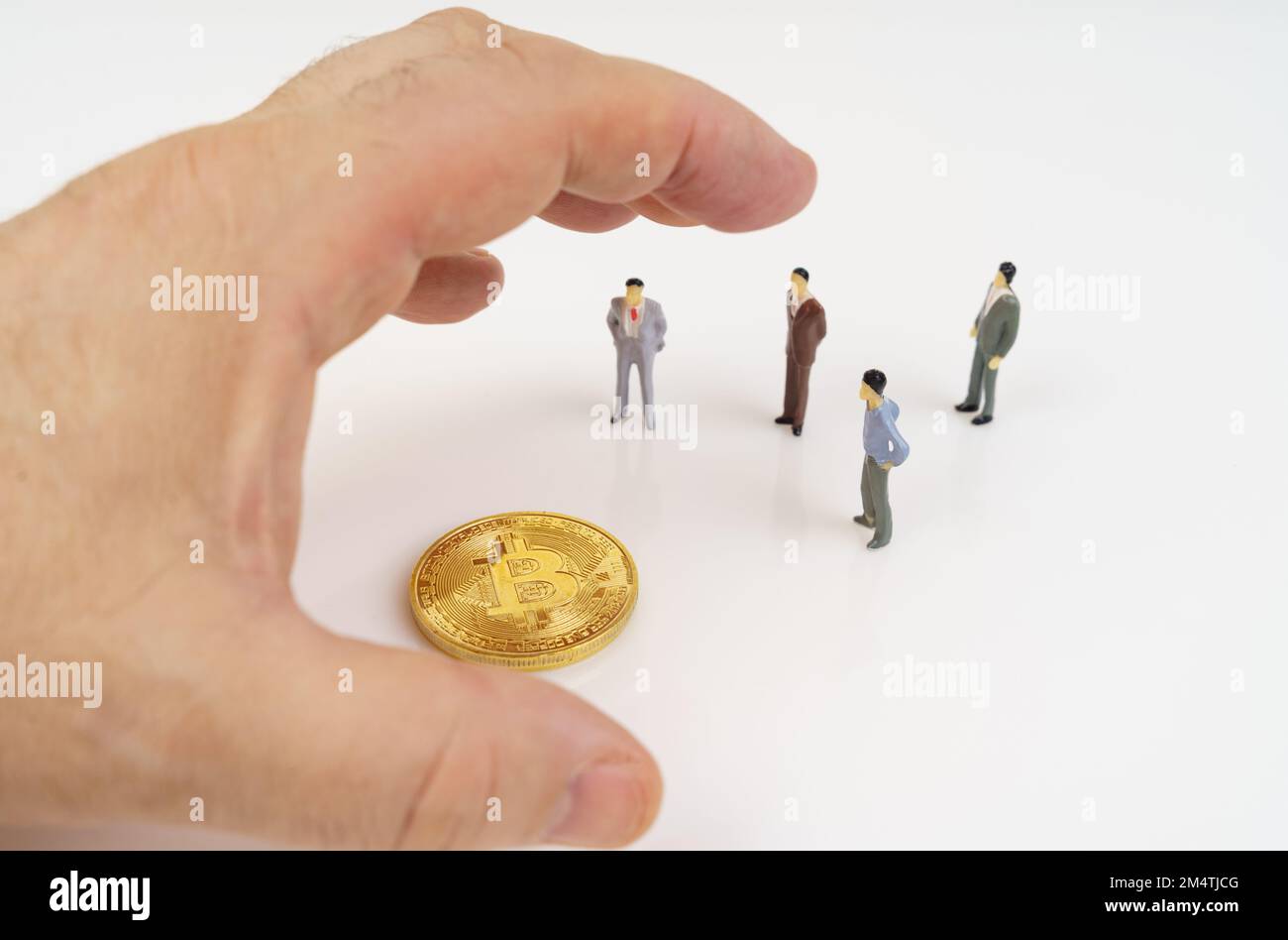 Cryptocurrency and business concept. On a white surface, bitcoin ...