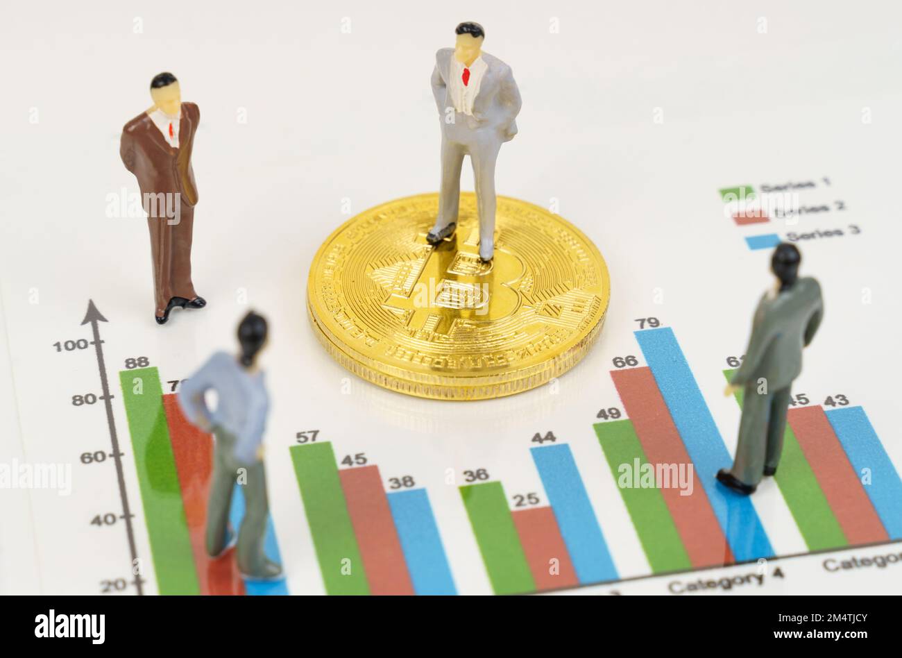 Cryptocurrency and business concept. On the business charts are ...