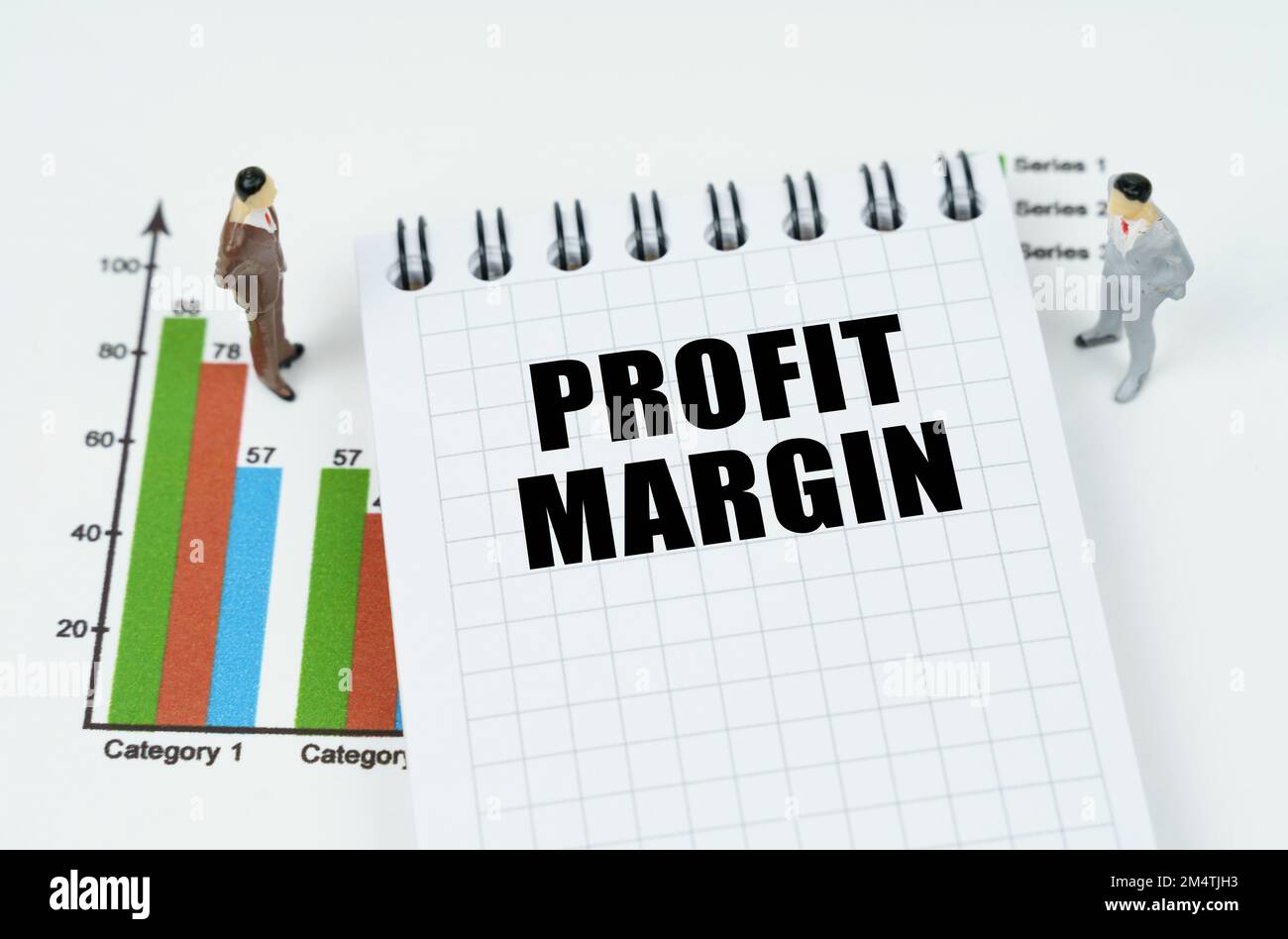 Business and finance concept. On the chart there are miniature figures ...