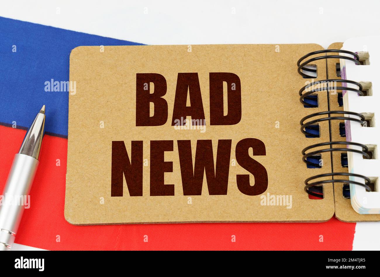 Business and technology concept. On the flag of Russia lies a pen and a ...