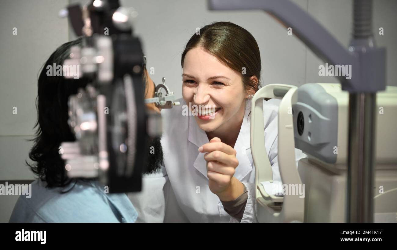 Ophthalmologist checking eye vision of patient for spectacles glasses ...