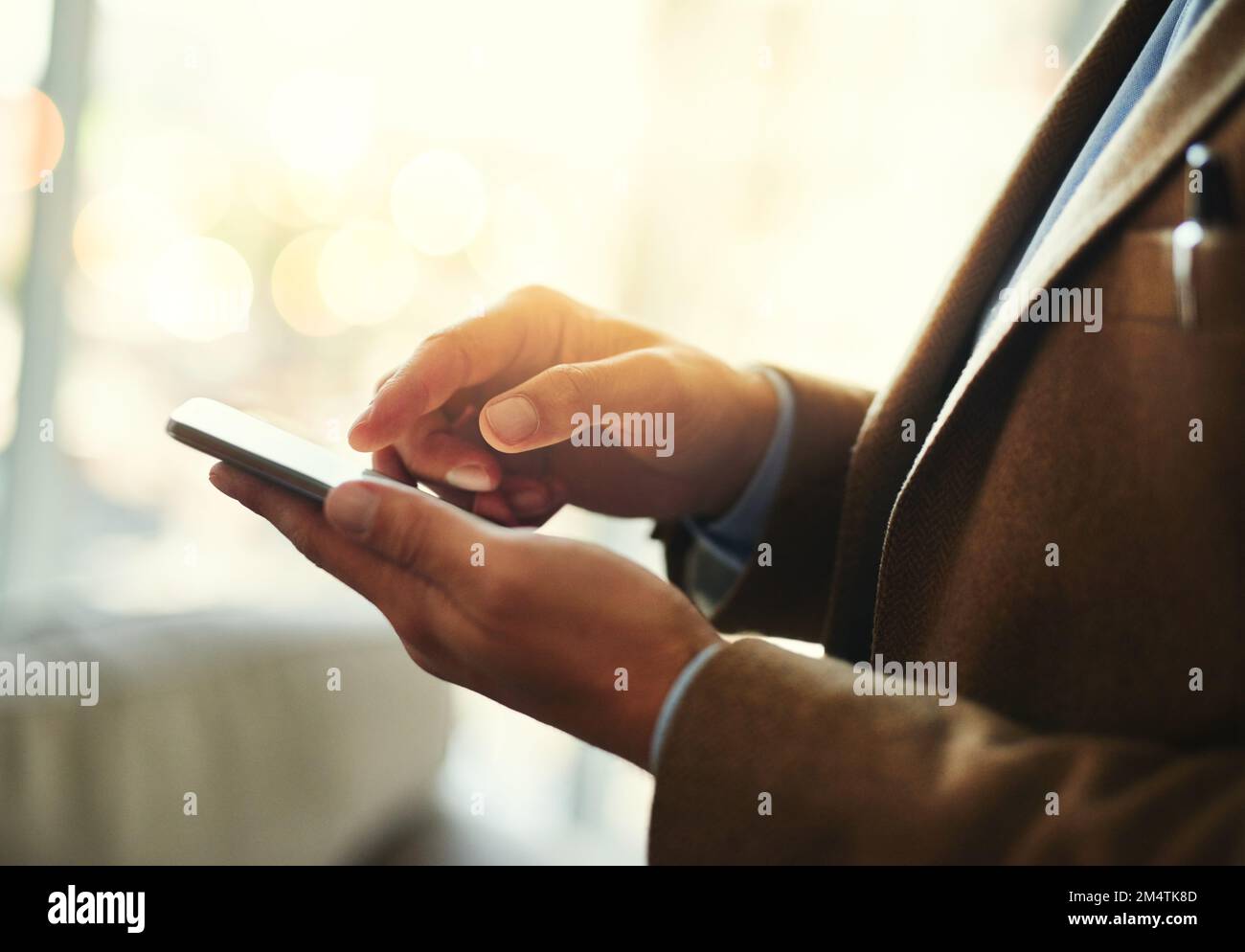 Going wireless. High angle shot of an unrecognizable businessman using ...