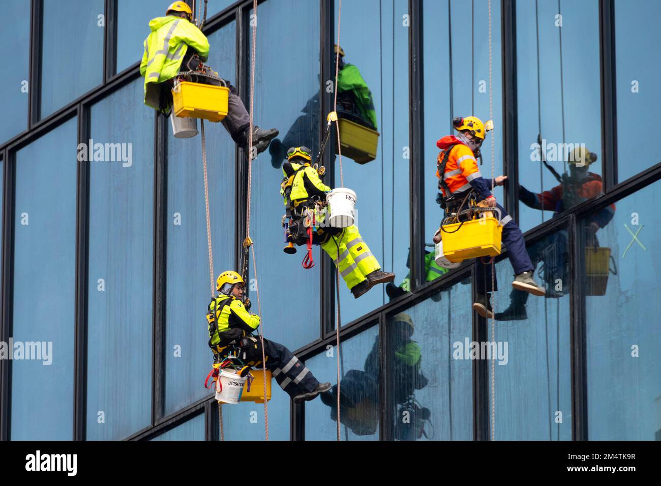 Workers cleaning windows on high office building, Wellington, North ...