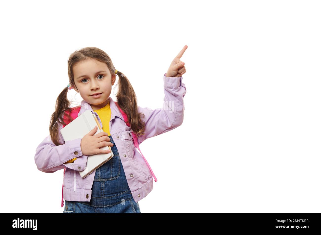 Lovely baby girl, elementary age student with two funny ponytails ...