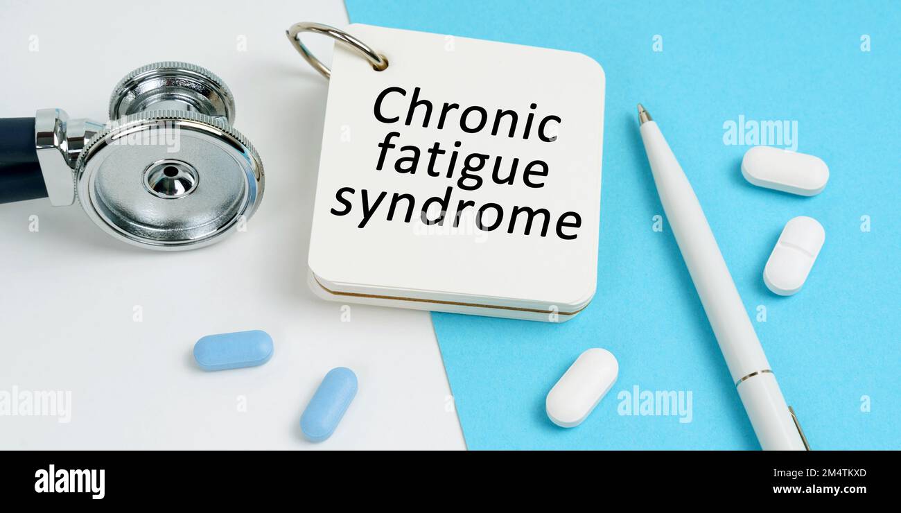 Medical concept. On a white and blue surface are pills, a stethoscope ...