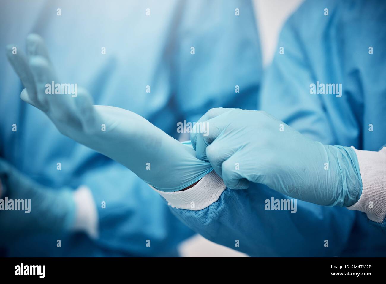 Healthcare, hands and doctor with gloves in hospital ready for surgery ...