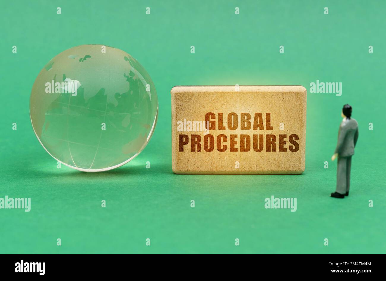 Technology and business concept. On the green surface is a globe and a ...