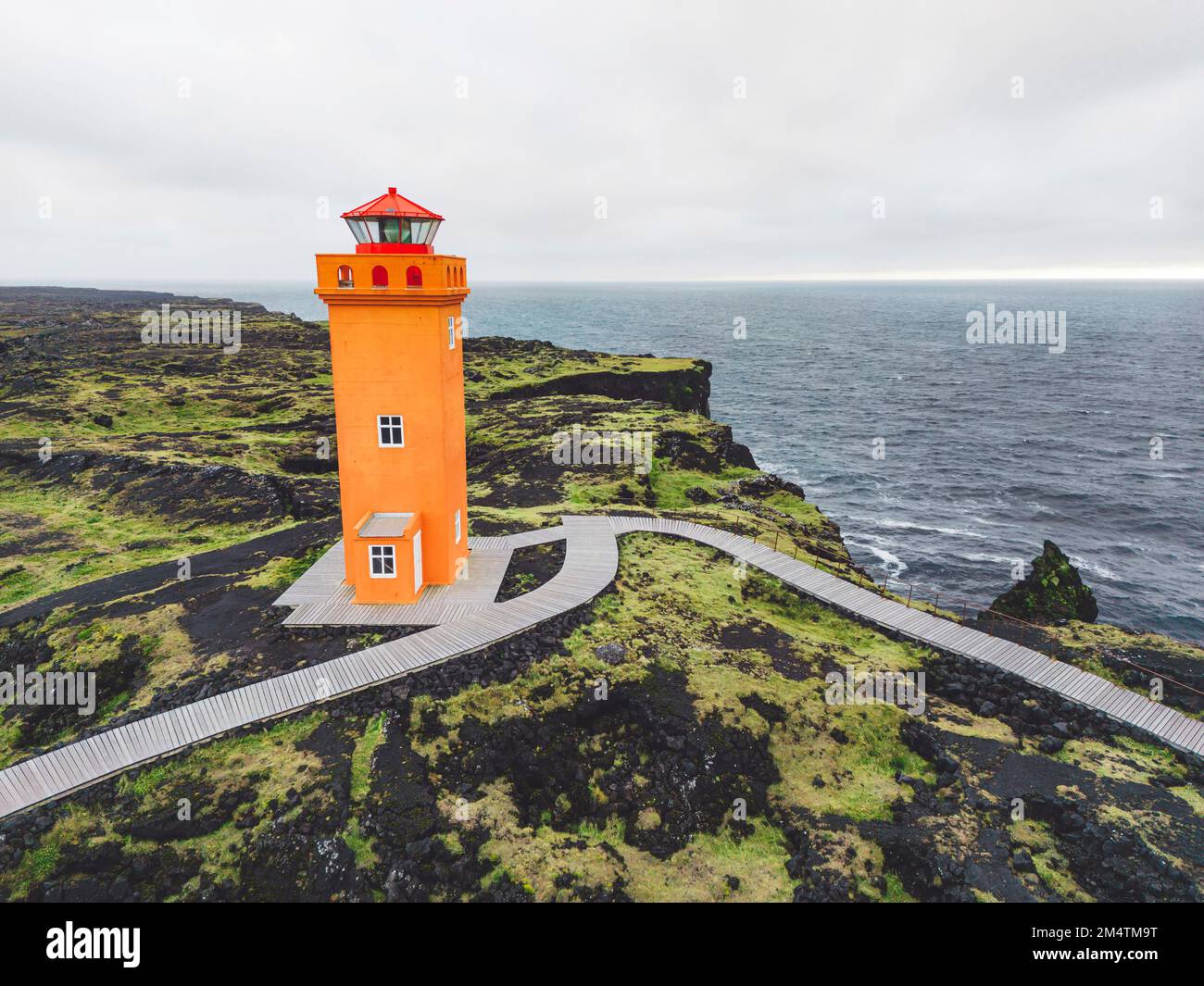 Scenic lighthouse at the edge of the cliff, Svortuloft Lighthouse, lava ...