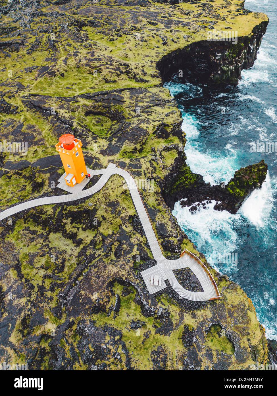 Vertical photo of bright orange Svortuloft Lighthouse on Snaefellsnes ...