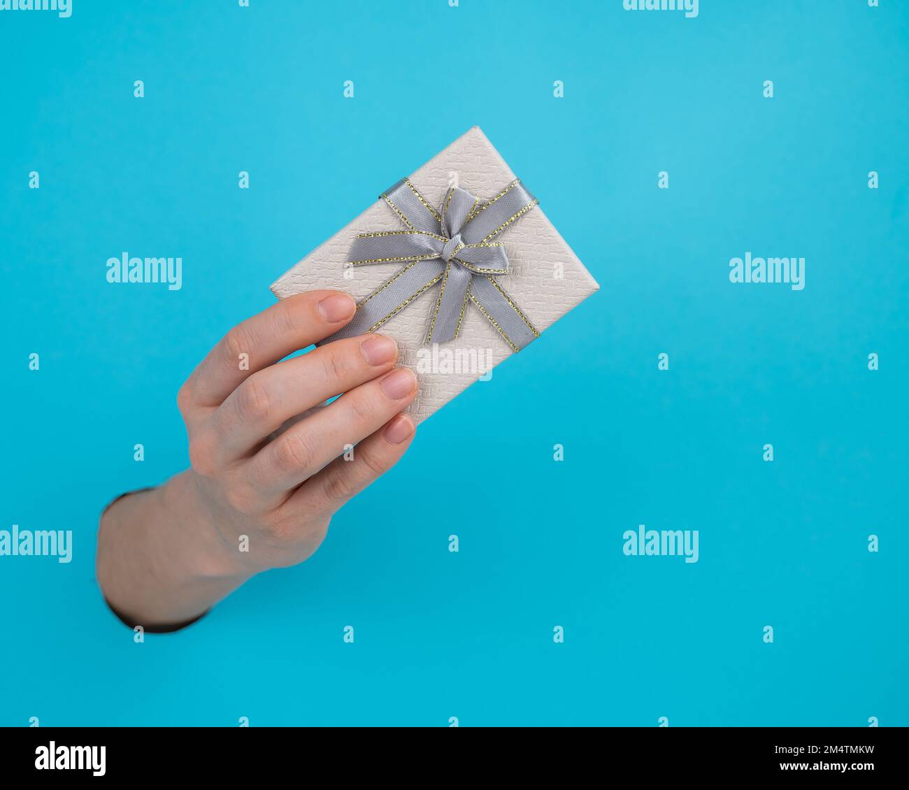 Woman holds blue ribbon hi-res stock photography and images - Alamy