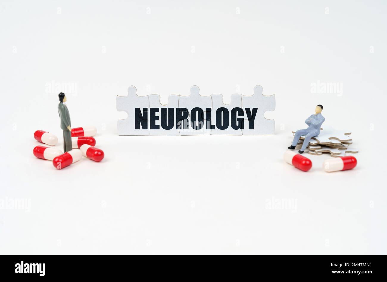 Medical concept. On the white surface of the tablet, miniature human ...