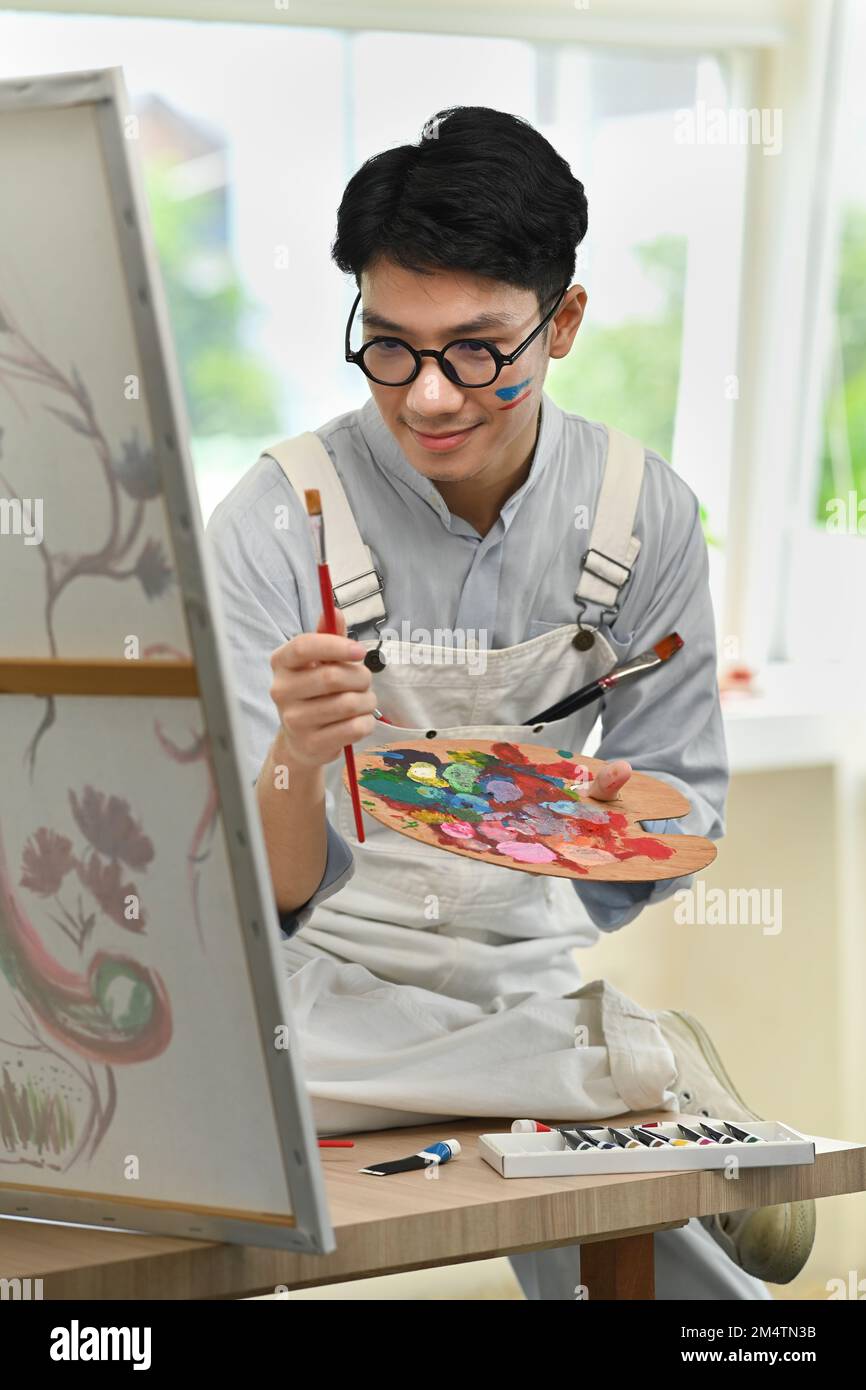 Talented male artist working on hi-res stock photography and images - Alamy