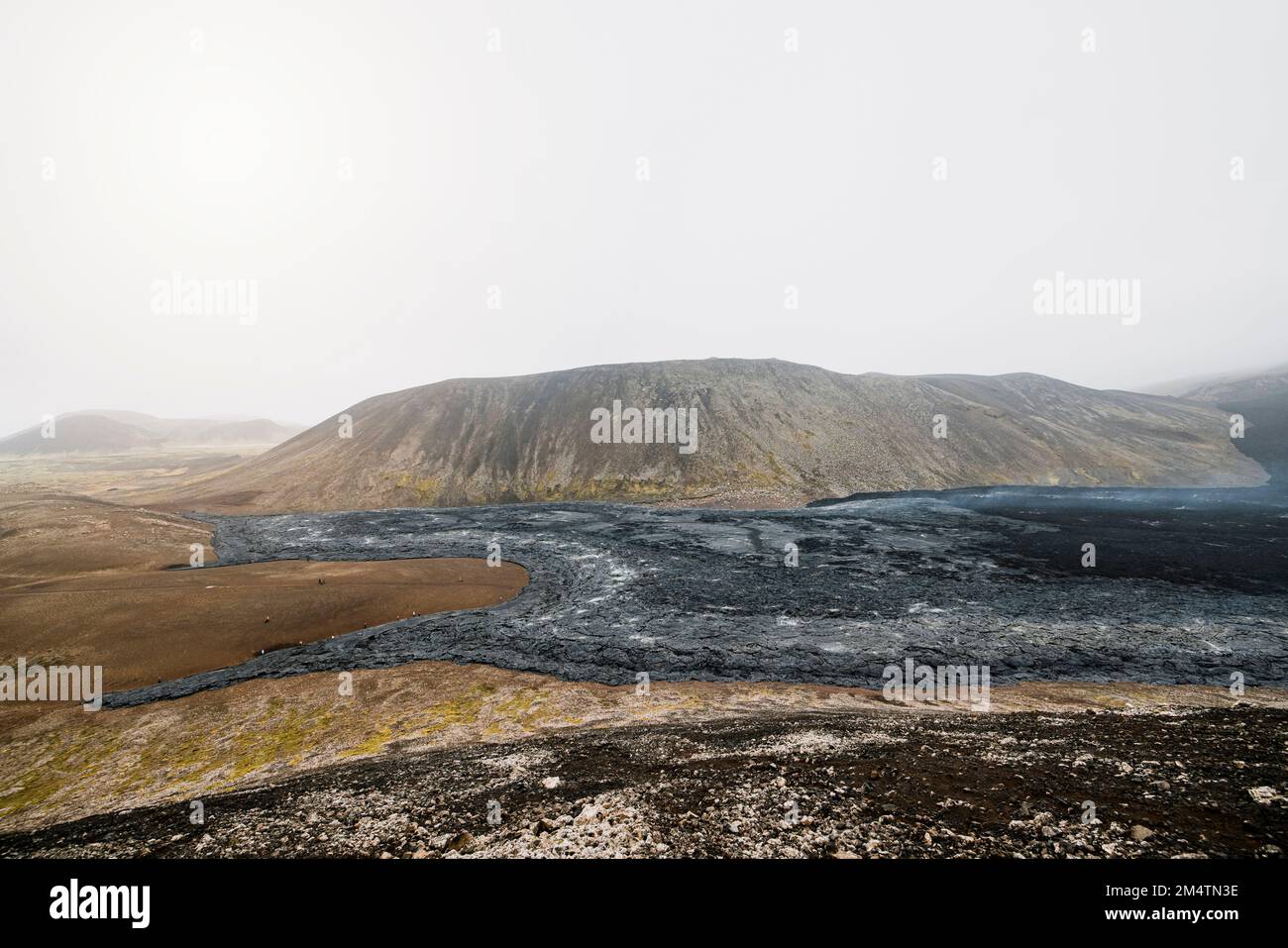 Black volcanic lava rocks in the valley still cooling down near ...