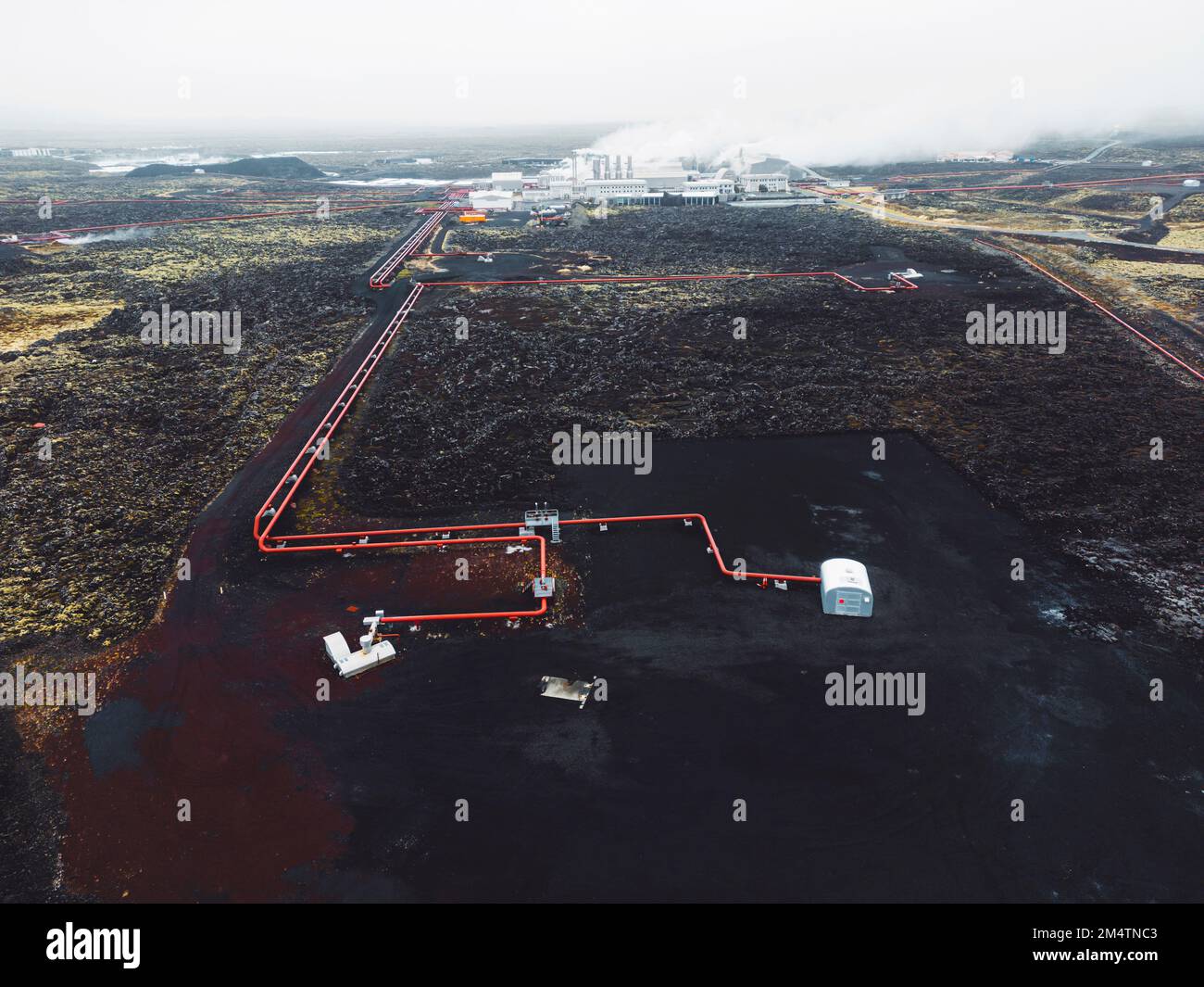 Aerial view of bright red pipes indicating hot thermal water running to ...