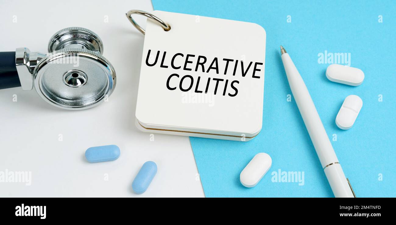 Medical concept. On a white and blue surface are pills, a stethoscope ...