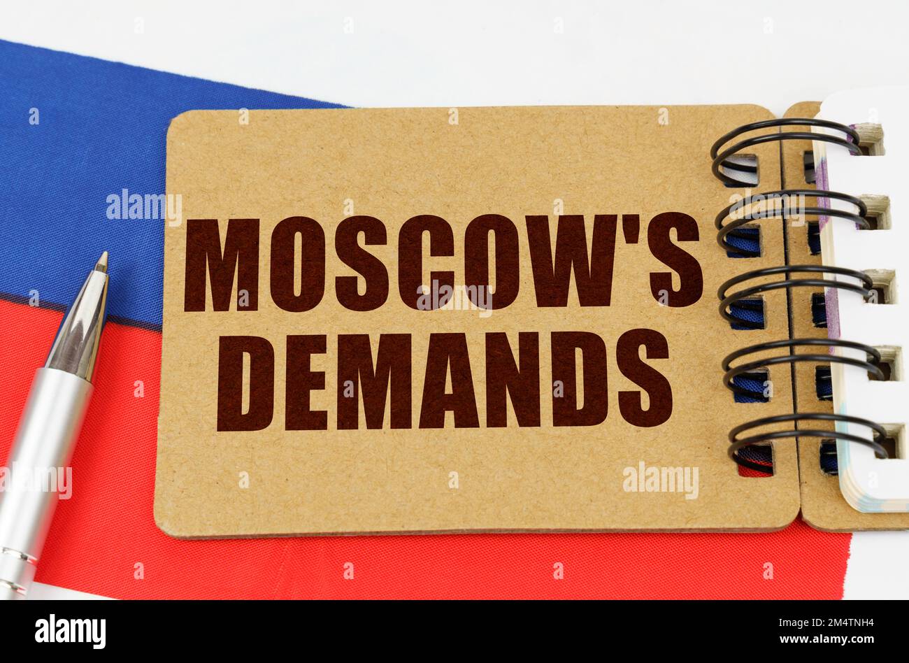 national concept. On the flag of Russia lies a pen and a notepad with ...