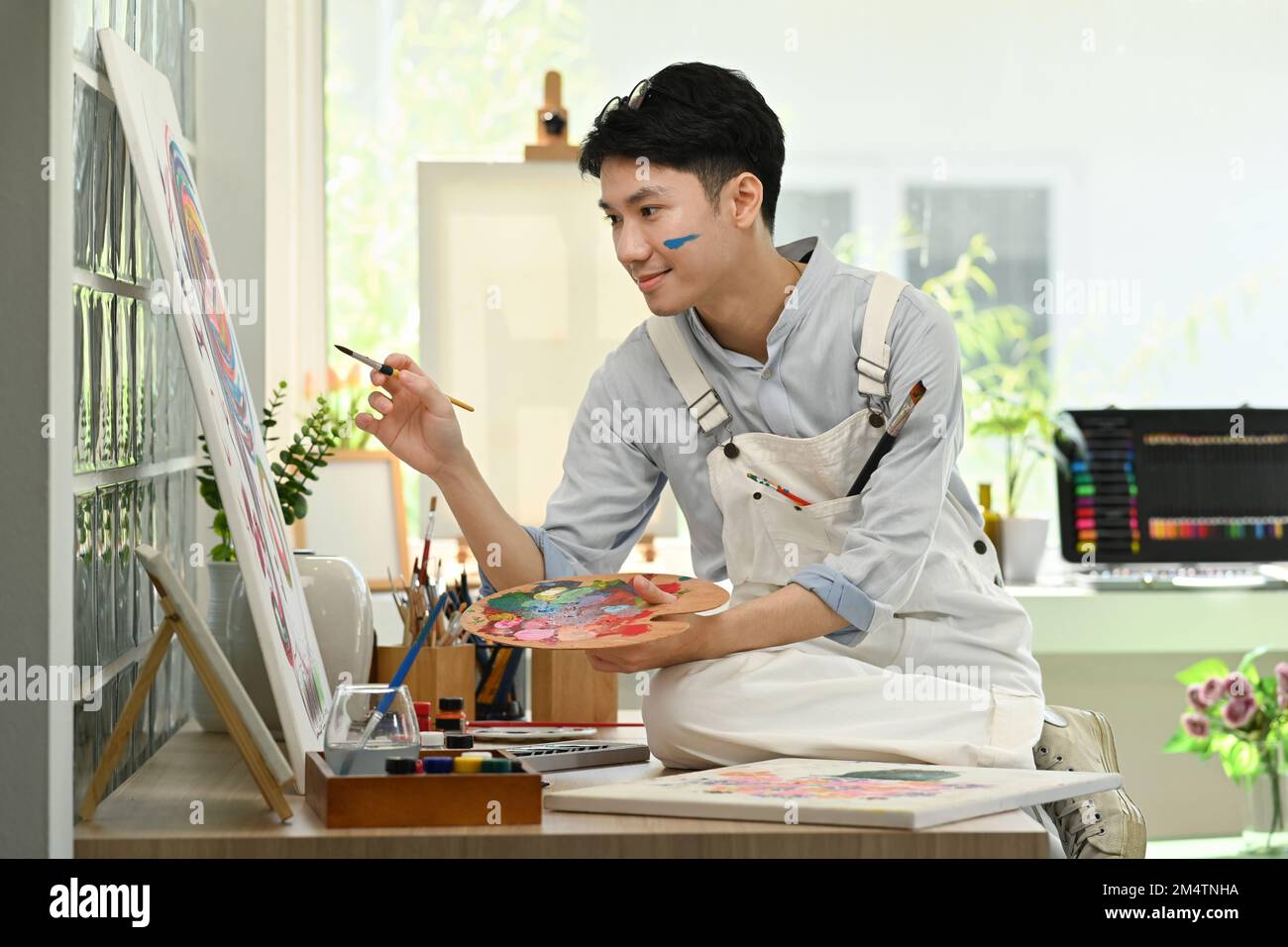 Talented male artist working on hi-res stock photography and images - Alamy