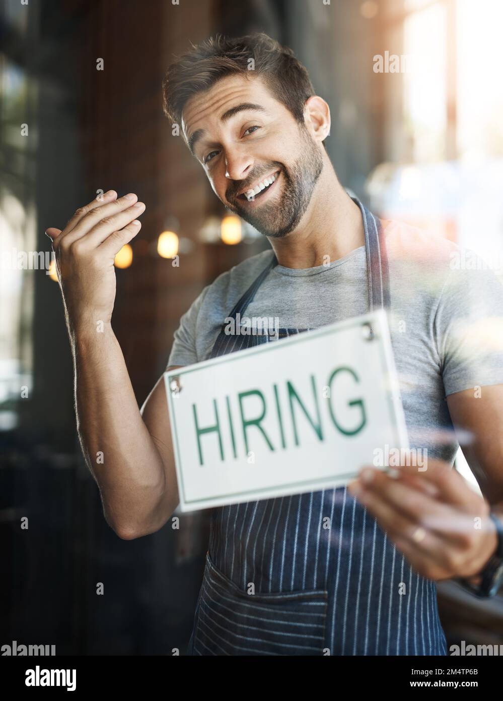 Were looking for new talent. Portrait of a handsome young man hanging ...