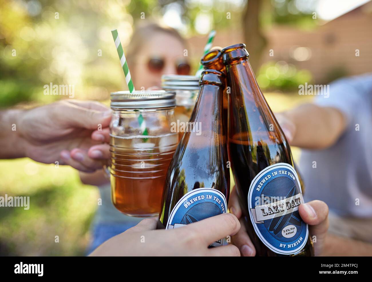 Cheers to us. a young group of friends toasting while enjoying a few ...