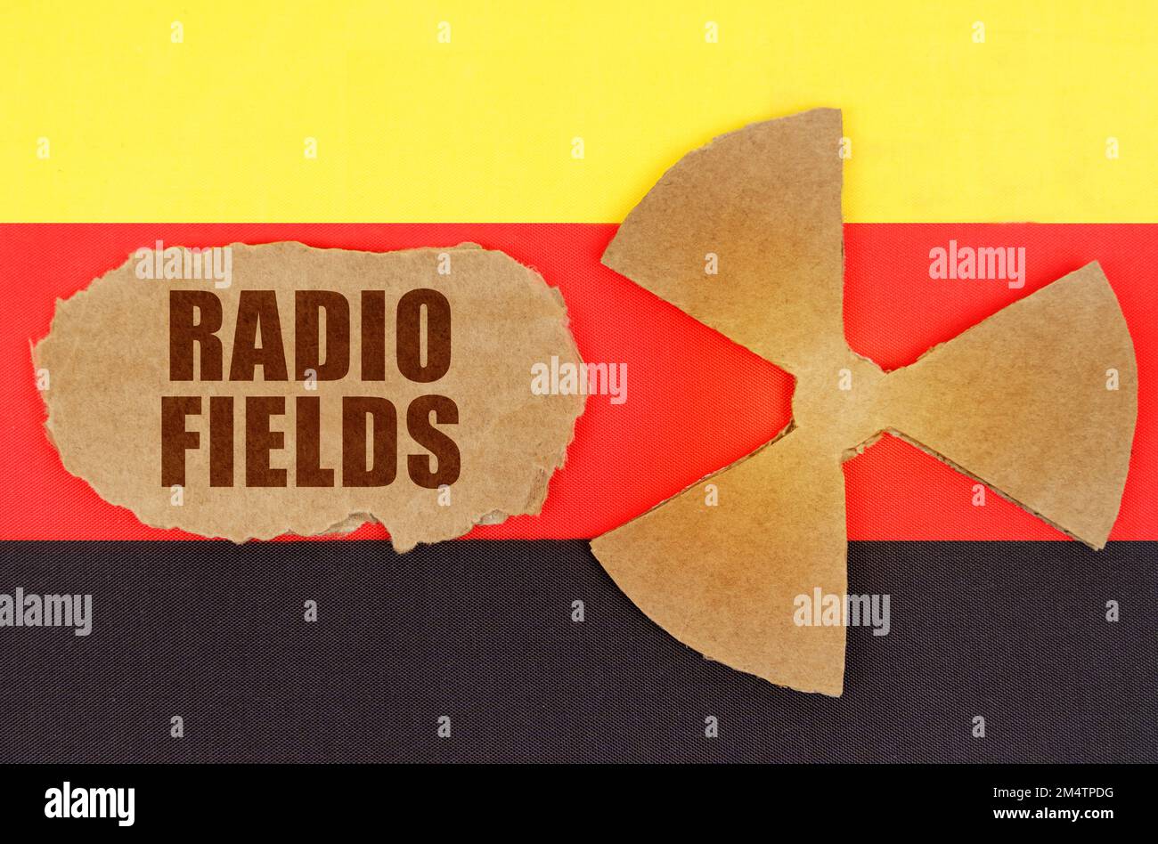 The concept of industry and radiation. On the flag of Germany, the symbol of radioactivity and ...