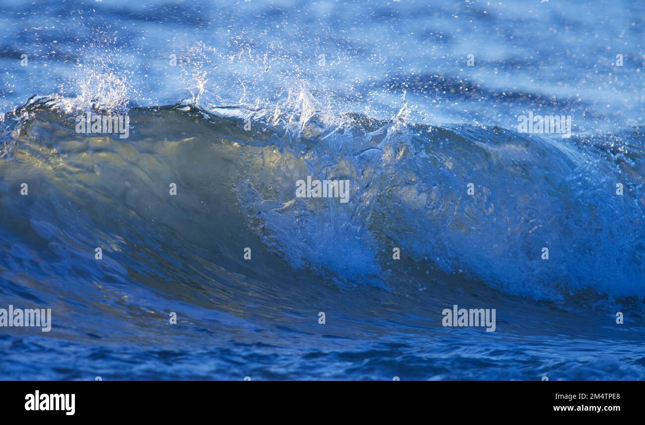 Ocean wave splashing Stock Photo - Alamy