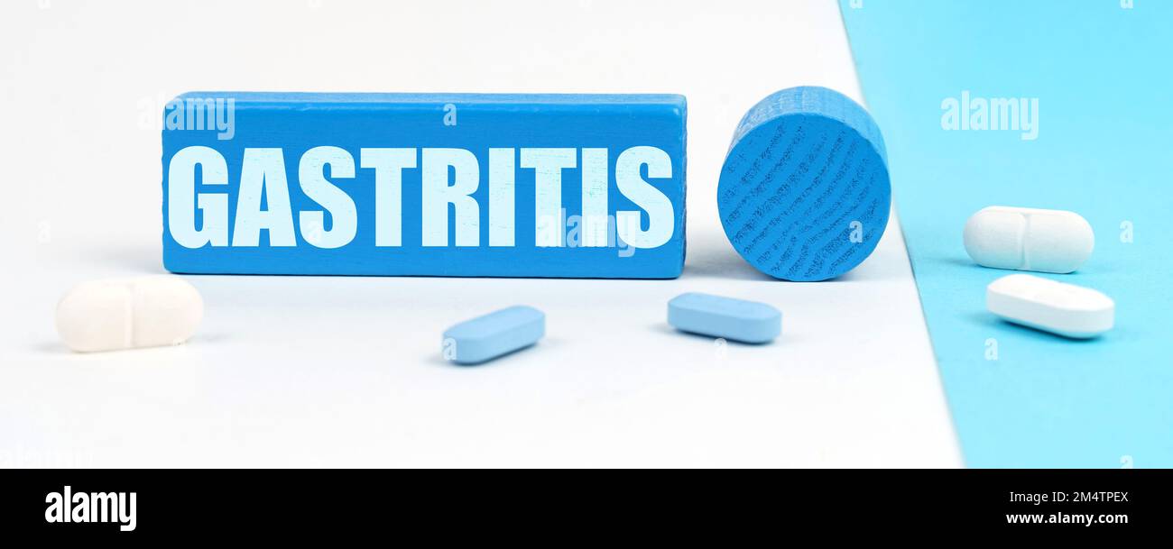 Medical concept. On a white and blue surface are pills, a stethoscope ...