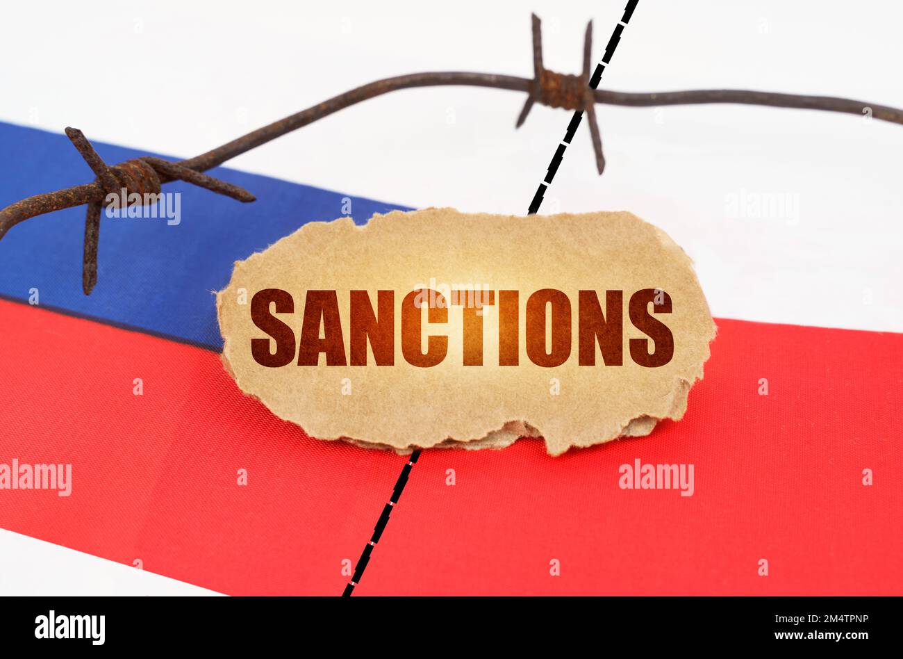 Political concept. On the flags of Poland and Russia lies a cardboard ...