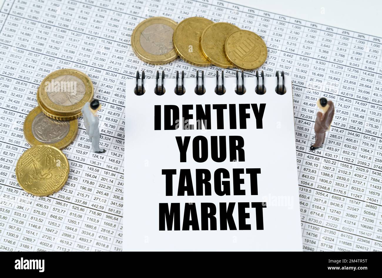 Business and finance concept. On financial reports there are figurines ...