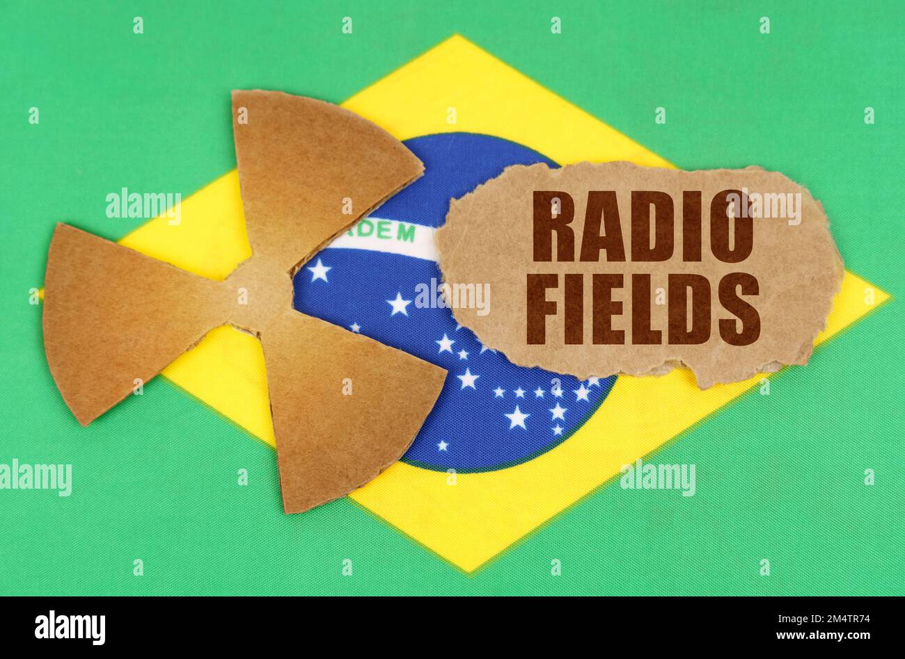 The concept of industry and radiation. On the flag of Brazil, the symbol of radioactivity and ...