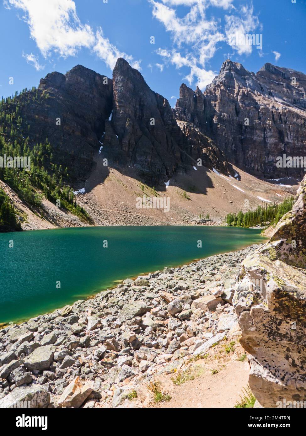 The scenic Agnes lake and the Devil's thumb mountain in Banff National ...