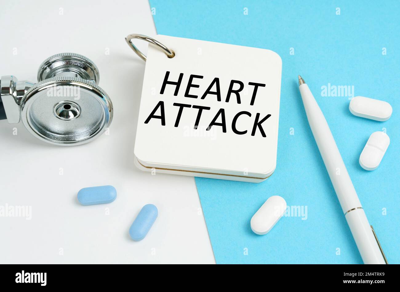 Medical concept. On a white and blue surface are pills, a stethoscope ...