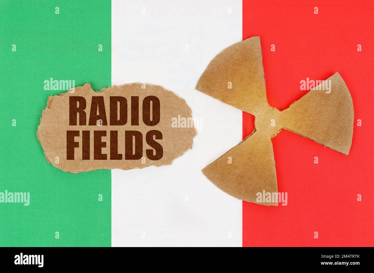 The concept of industry and radiation. On the flag of Italy, the symbol of radioactivity and ...