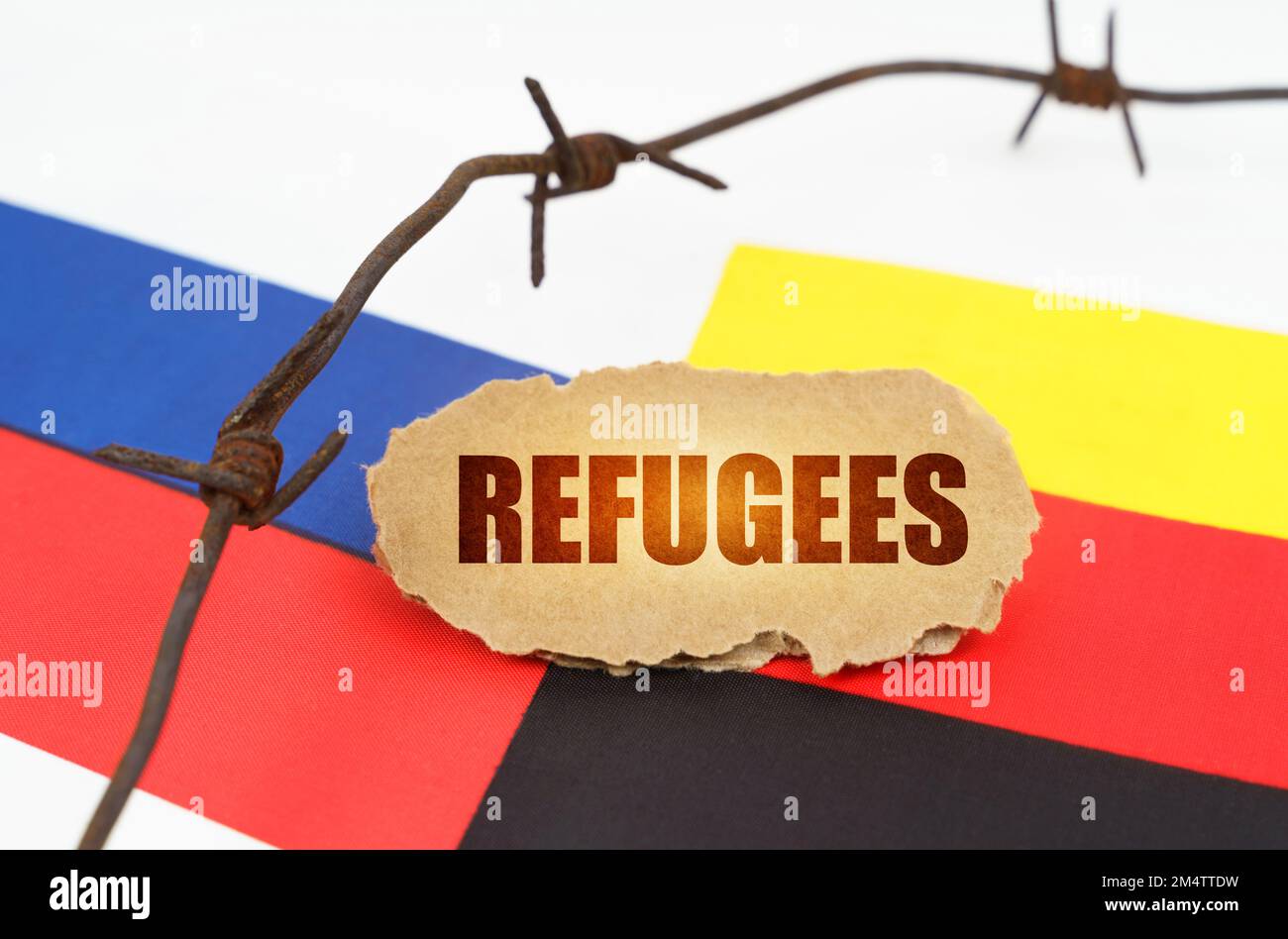 Political concept. On the flags of Germany and Russia lies a cardboard ...