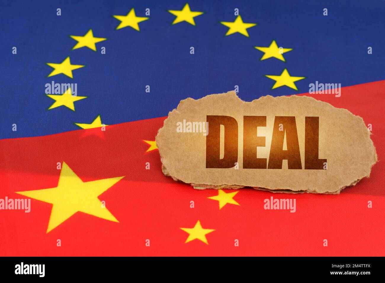 Political concept. On the flags of China and the European Union lies a ...