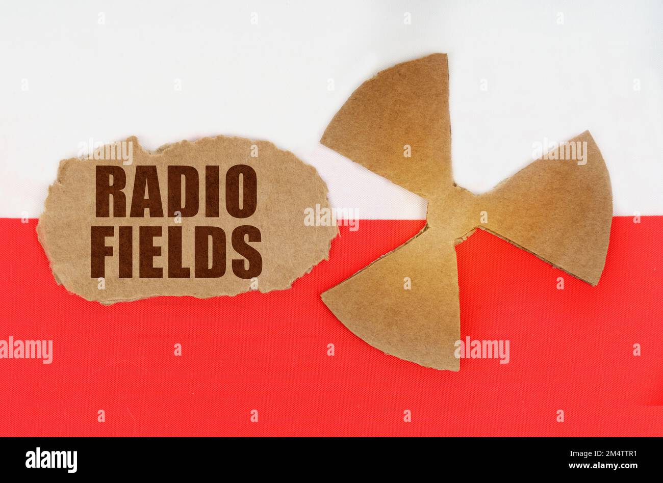 The concept of industry and radiation. On the flag of Poland, the symbol of radioactivity and ...