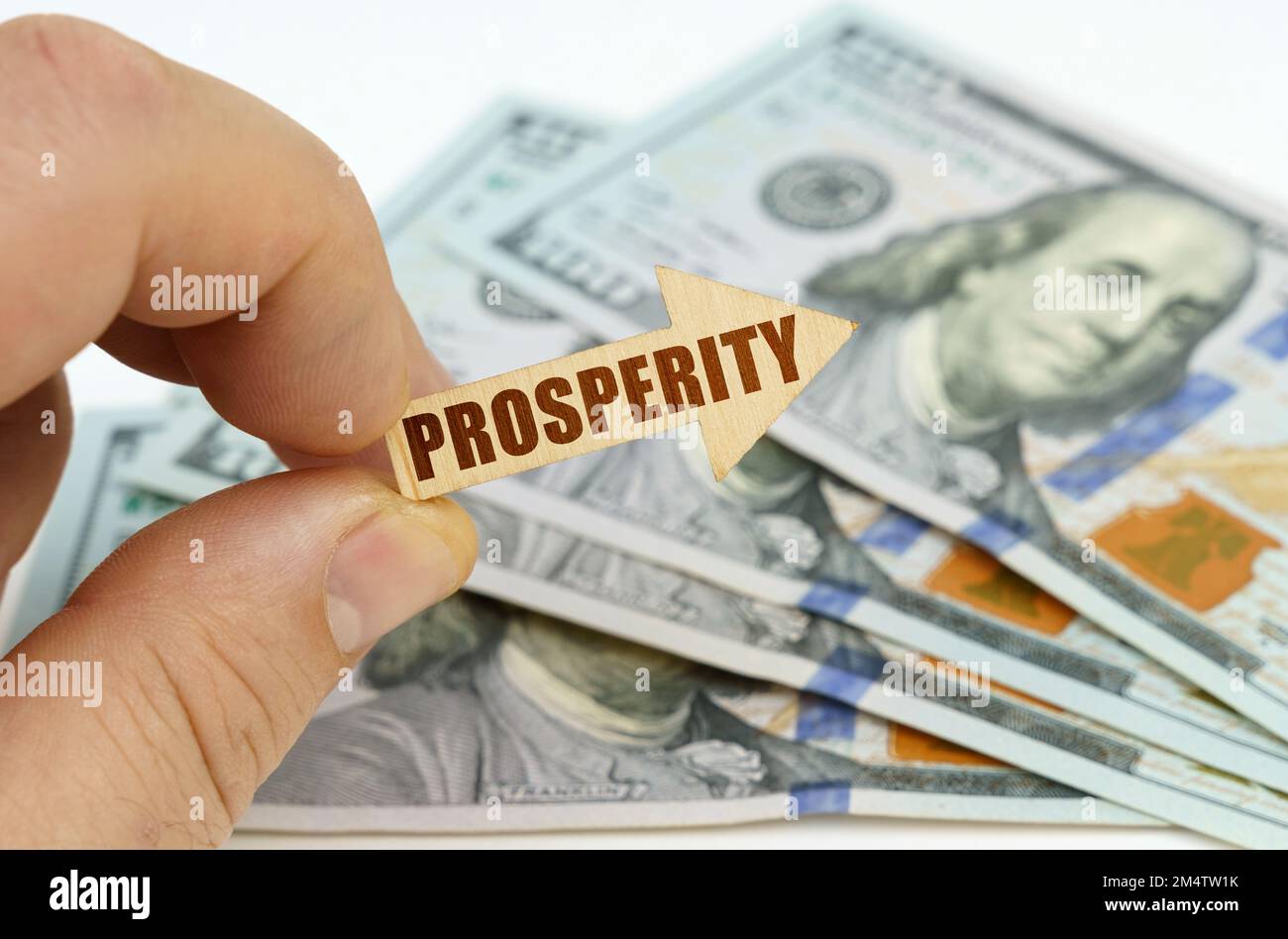 Business and finance concept. In the hands of a man is an arrow with ...