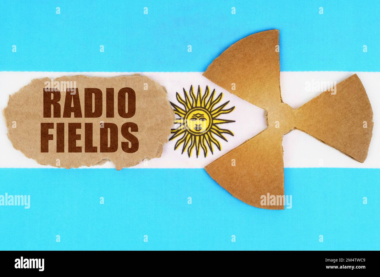 The concept of industry and radiation. On the flag of Argentina, the symbol of radioactivity and ...