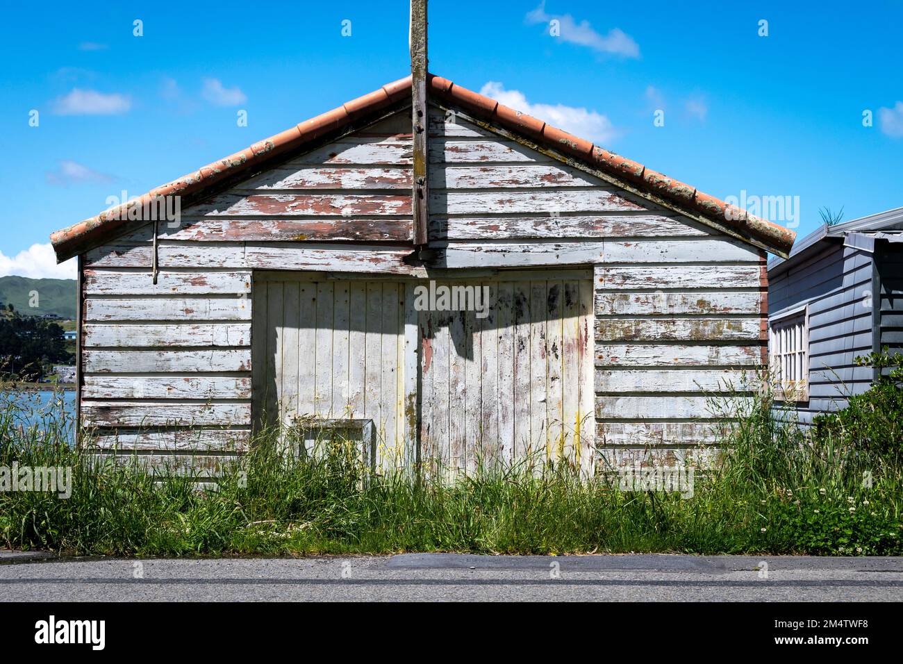 Boat shed with peeling paint, Onepoto, Titahi Bay, Porirua, Wellington, North Island, New ...