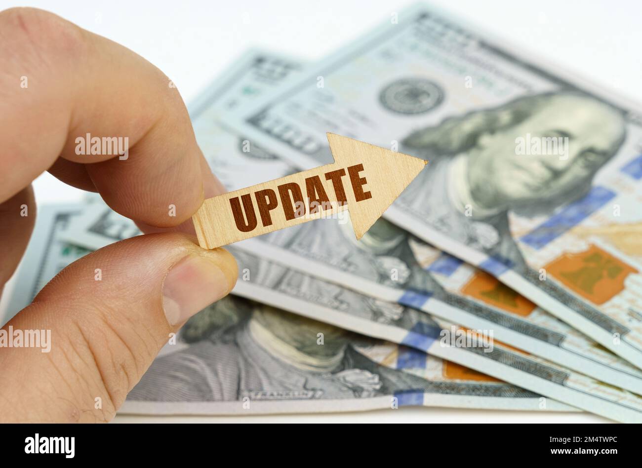 Business and finance concept. In the hands of a man is an arrow with ...