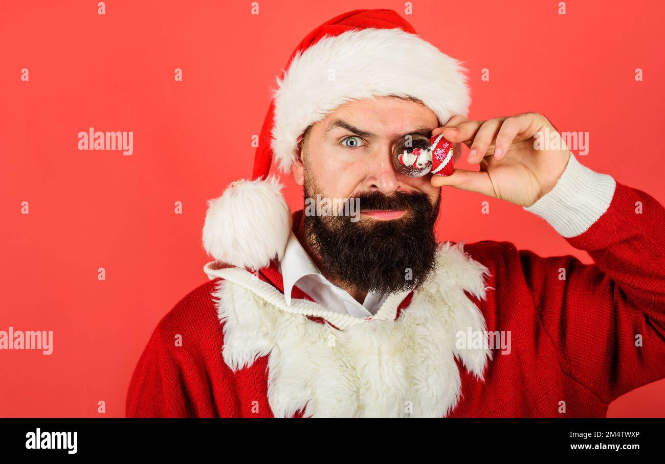 Santa Claus with Christmas snow globe covering eye. Decoration element ...