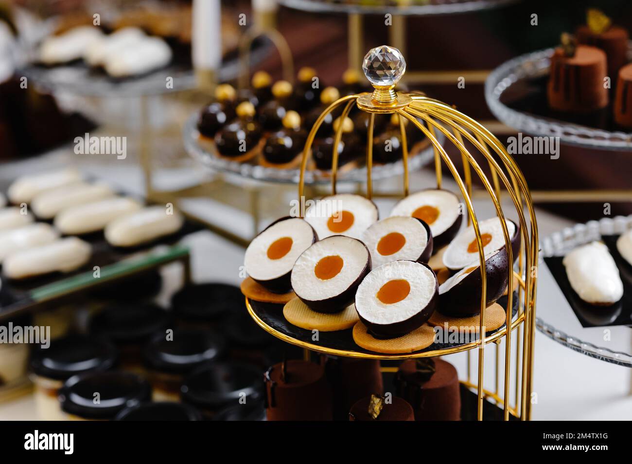 Many cakes standing among the candy bar. Sweet table. Banquet table ...