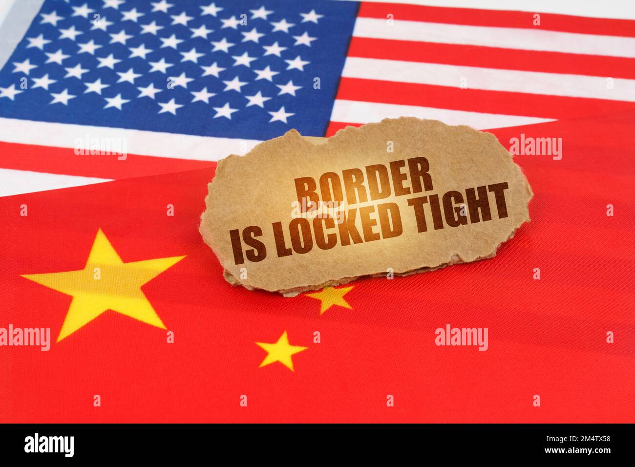 Political concept. On the flags of China and the United States lies a ...