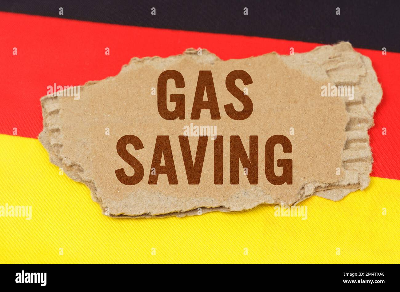 Economy and finance concept. On the flag of Germany lies a cardboard ...